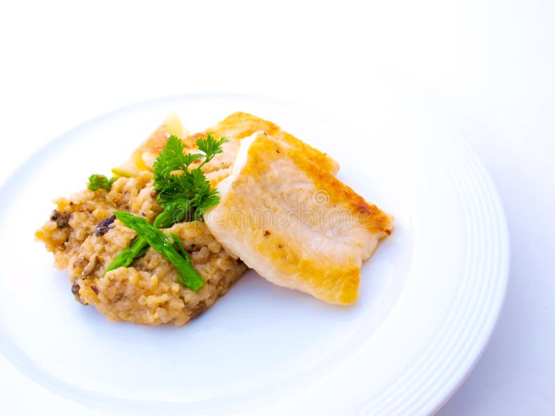 Gourmet Fish Fillet with Risotto on White Plate Stock Photo - Image of ...