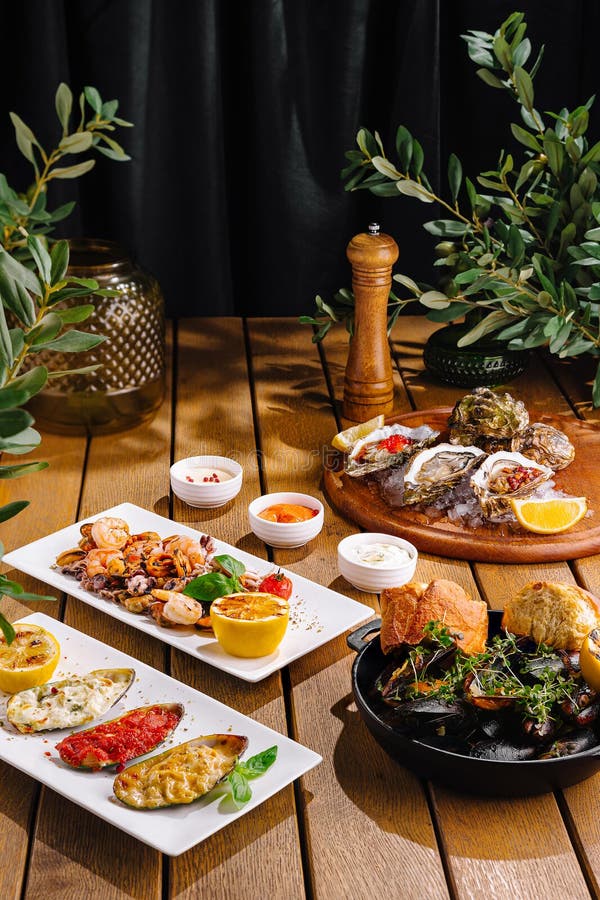 Gourmet Mediterranean Feast on Rustic Wooden Table Stock Image - Image ...