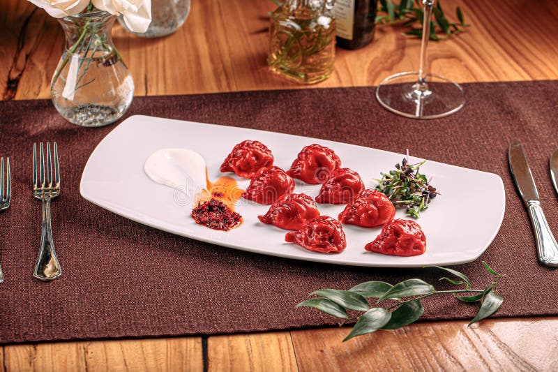Gourmet Red Colored Dumplings with Sauce Stock Photo - Image of colored ...