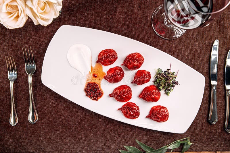 Gourmet Red Colored Dumplings with Sauce Stock Image - Image of black ...