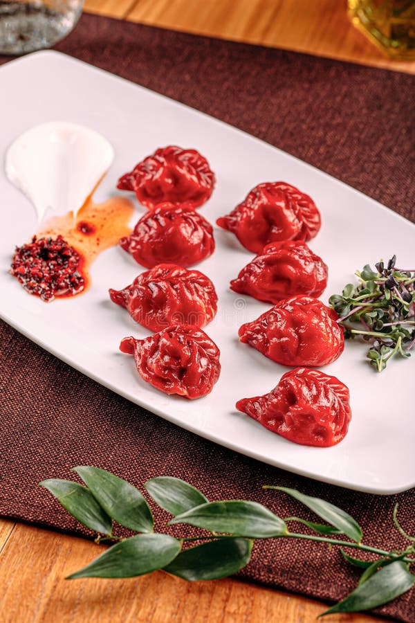 Gourmet Red Colored Dumplings with Sauce Stock Photo - Image of lunch ...