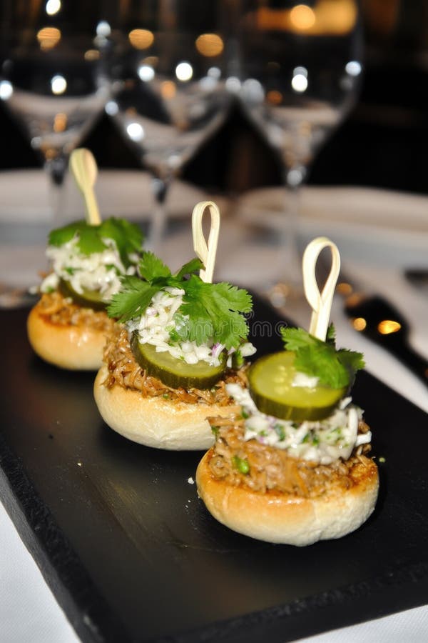 Gourmet Sliders with Pulled Pork, Slaw, and Pickles on Slate Plate ...