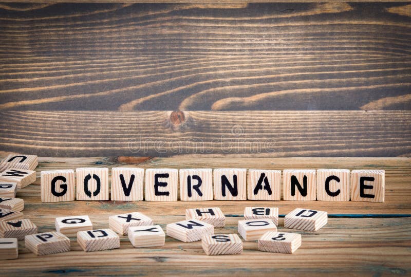 Governance. Wooden Letters on the Office Desk, Informative and ...