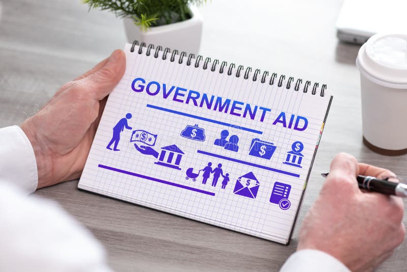 Government Aid Concept on a Notepad Stock Photo - Image of hand ...