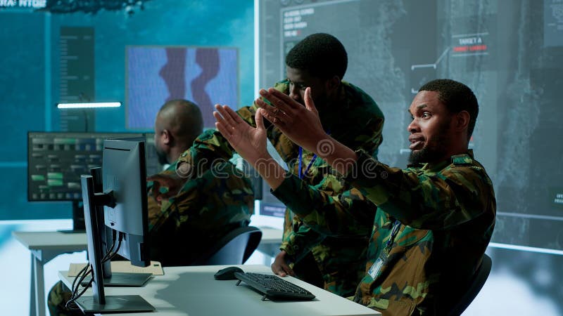 Government Analysts Work in an Advanced Command Center with Satellite ...