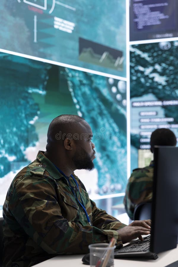 Government Intelligence Officers in a Command Post Oversee Satellite ...