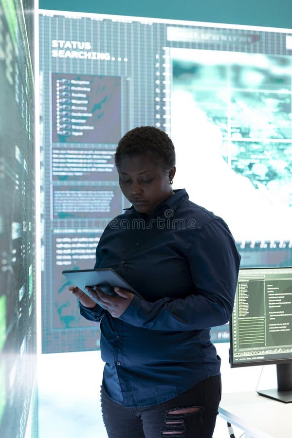 Governmental Hacker Woman Working with a Tablet and Big Screen Stock ...