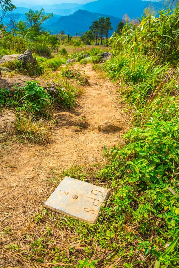 GPS benchmark on mountain stock photo. Image of grass - 212129586