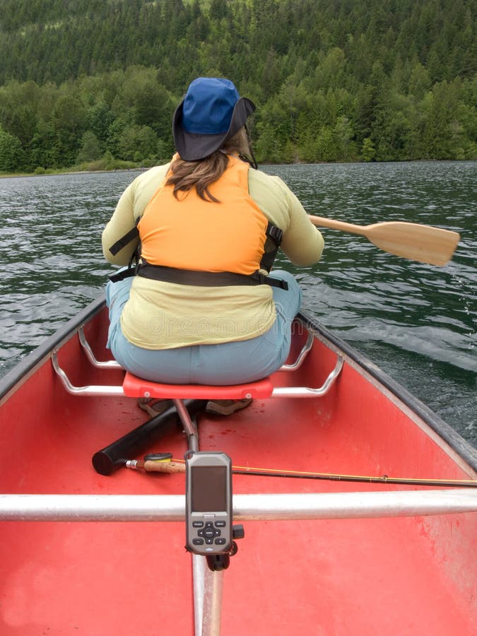GPS and canoe paddling stock image. Image of woman, gadget - 14497917