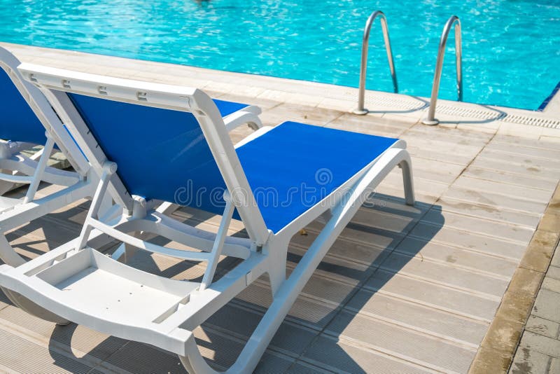 Grab Bars Ladder in the Blue Swimming Pool Stock Image - Image of ...