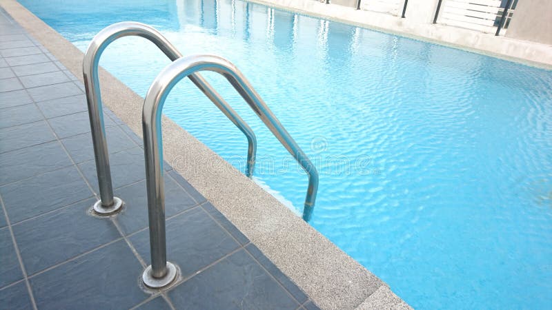 Grab Bars Ladder in Swimming Pool Stock Photo - Image of outdoors ...