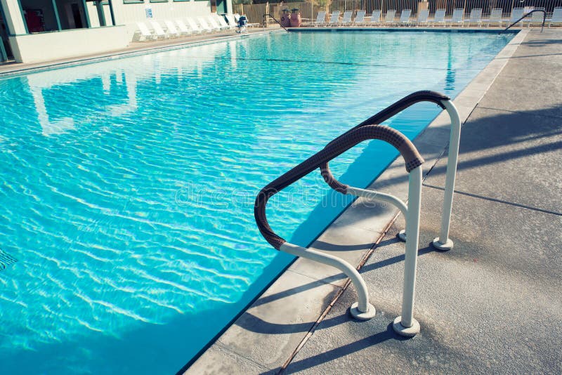 Grab Bars Ladder in the Swimming Pool, Outdoor Stock Photo - Image of ...