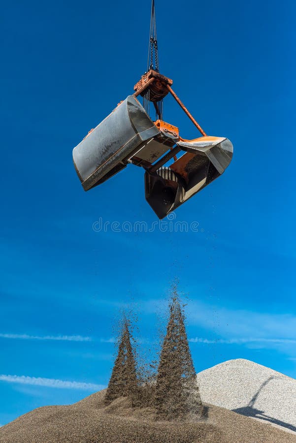 Grab Crane Fills Sand on a Hill Stock Photo - Image of shipping, shovel ...