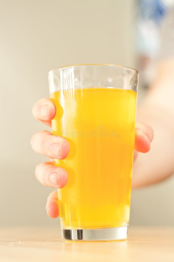 Grab a glass of OJ stock photo. Image of glass, orange - 12141582