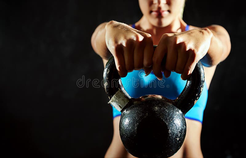 Grab Life by the Bells. a Young Woman Working Out Using a Kettlebell ...