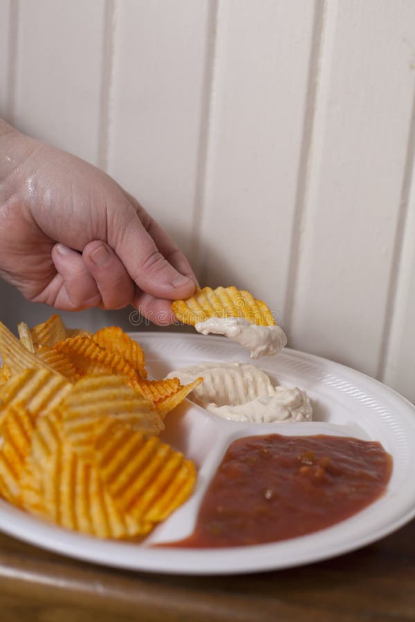 Grabbing a Chip stock image. Image of pile, meal, appetizer - 98711793