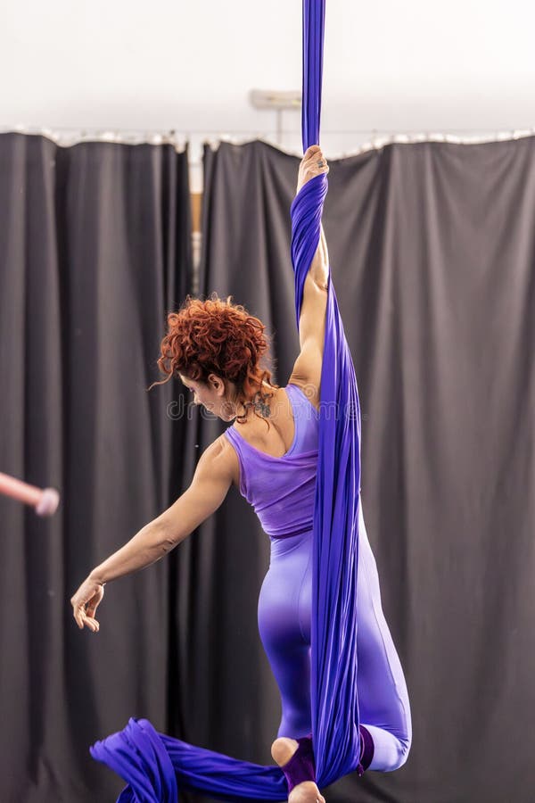 Aerial Acrobat Performing on Purple Silk in Studio Stock Image - Image of silk, body: 370025083
