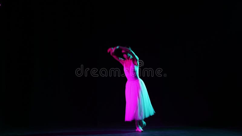 Graceful Ballerina In Elegant White Dress Practicing Base Movements In