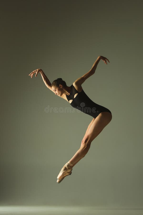 Young Graceful Female Ballet Dancer Dancing in Mixed Light Stock Photo ...