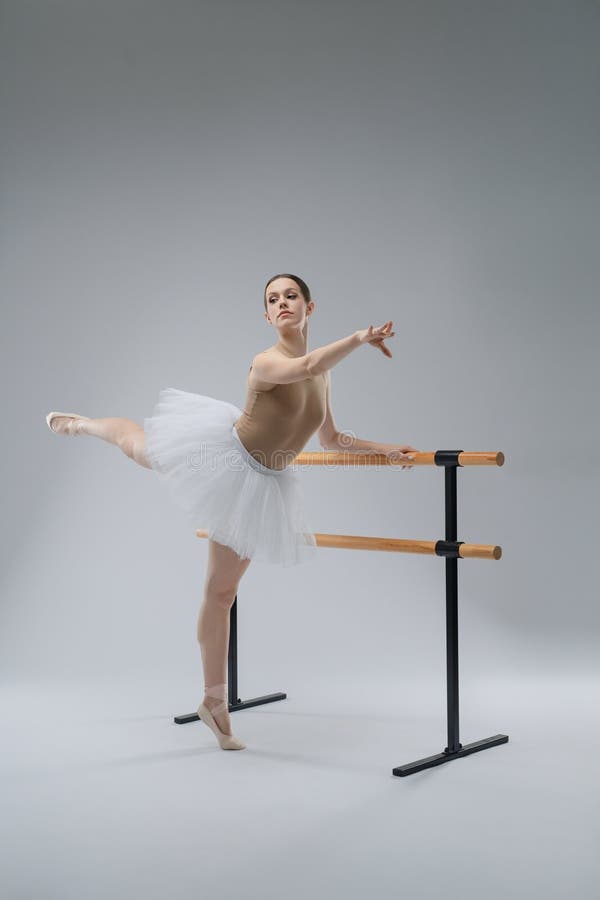 Graceful Ballet Dancer Practicing at a Dance Studio with Barre Stock ...