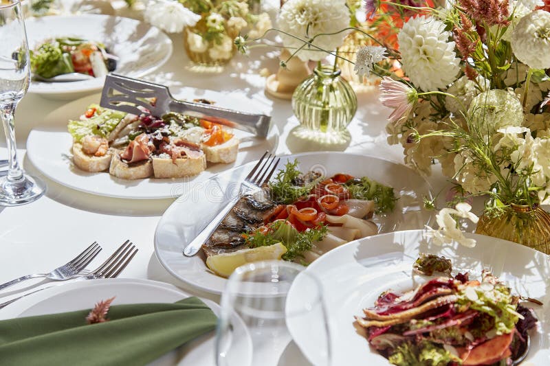 Graceful Chambers Table Setting, Arranged Flowers Under Hard Shadows ...