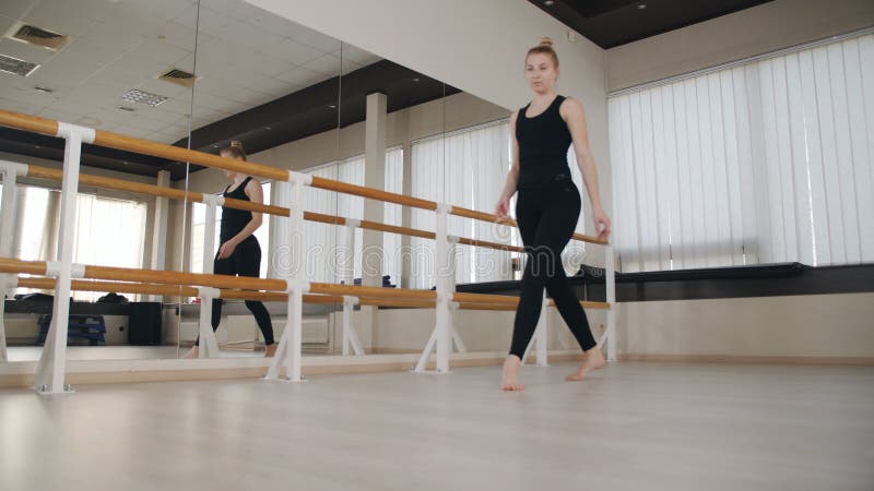 Graceful Classical Ballet Dancer in Sport Clothes Practicing Standing ...