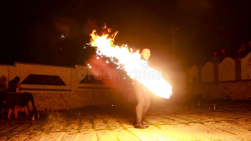 Graceful Man Dancing Passionate Dance with Fire Fan in His Hand. Fire ...