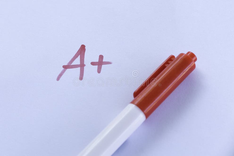 A+ Grade on Exam Paper with Red Pen on White Background Stock Image ...