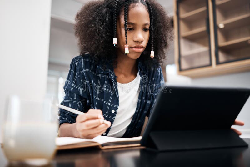 Grade a Tech for a Grade a Student. a Young Girl Using a Digital Tablet ...