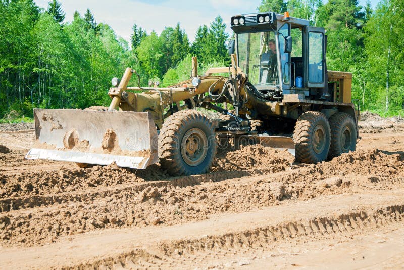 The Grader Clears Away a Ground Stock Photo - Image of earthmover ...