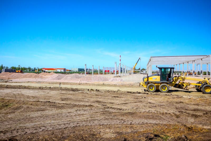 Grader is Leveling Ground at Construction Site Stock Photo - Image of ...