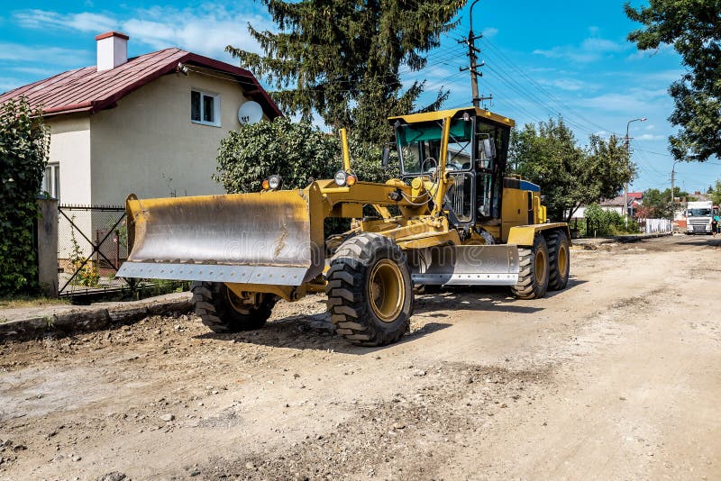 Grader levels the road stock photo. Image of soil, power - 201429500