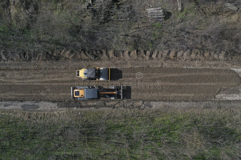 Grader Road Construction. a Motor Grader Works on a Site on a Road ...
