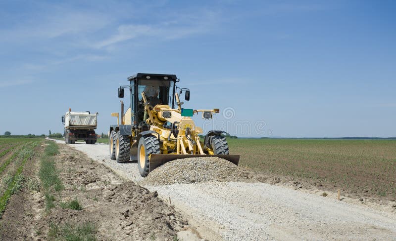Grader Working on Gravel Leveling Stock Photo - Image of grade, grader ...