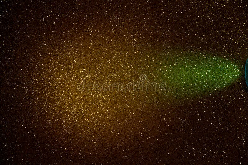 On a Gradient Golden Background in Fine Grain, a Ray of Green Light ...