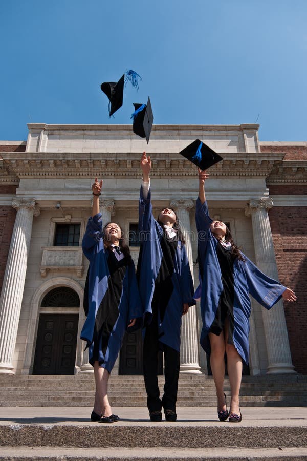 Two Graduate Girls in Evening Gown are Walking and Laughing with Ice ...