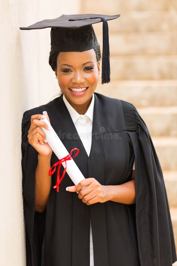 Graduate holding diploma stock image. Image of gown, diploma - 52815371