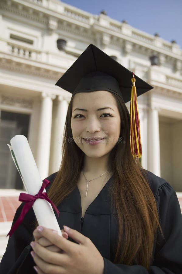 Graduate Holding Diploma Outside University Portrait Stock Image ...