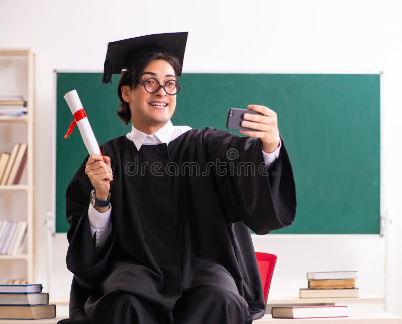 Graduate Student in Front of Green Board Stock Photo - Image of mortar ...