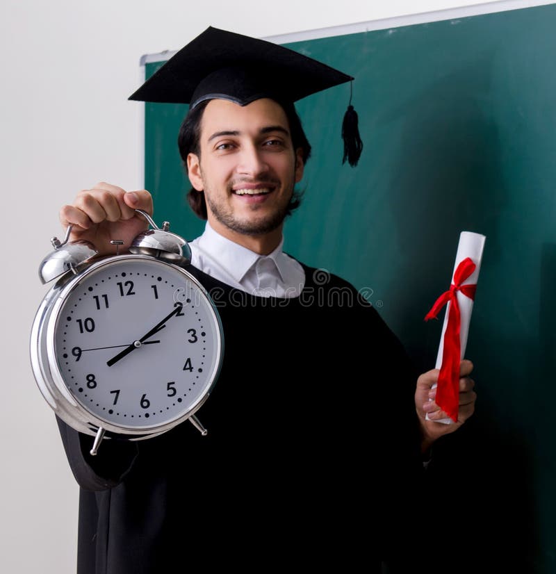 Graduate Student in Front of Green Board Stock Photo - Image of late ...