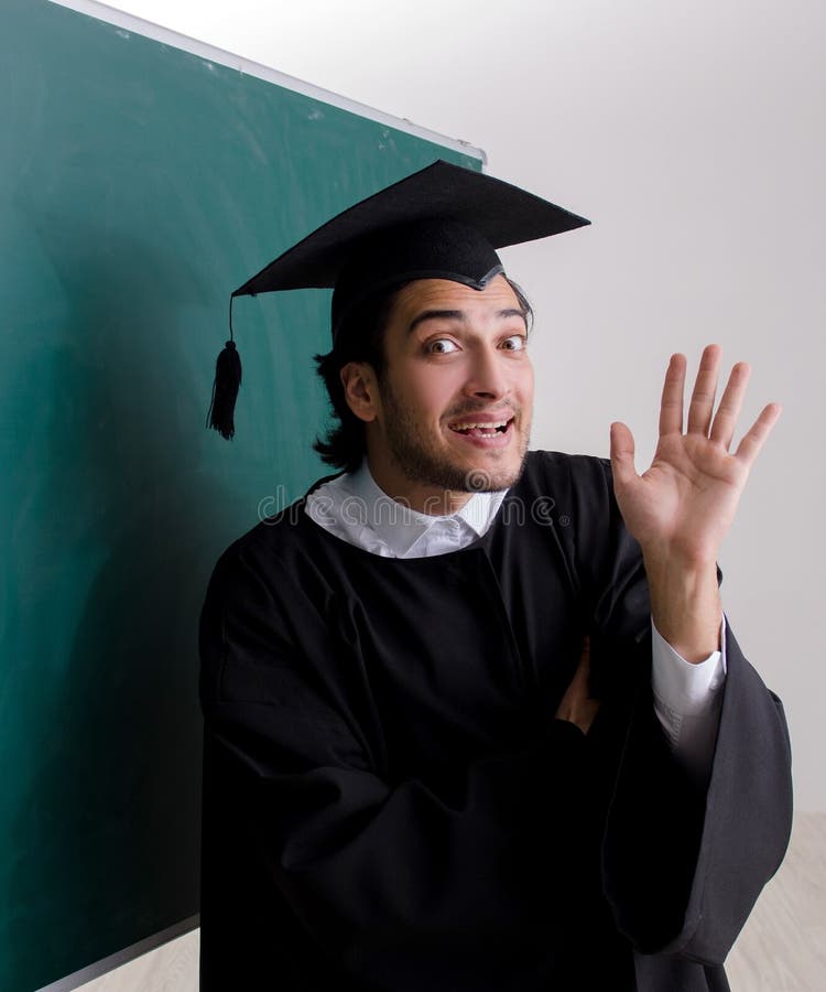 Graduate Student in Front of Green Board Stock Image - Image of mantle ...