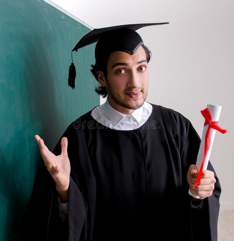 Graduate Student in Front of Green Board Stock Image - Image of degree ...