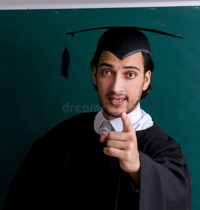Graduate Student in Front of Green Board Stock Photo - Image of happy ...