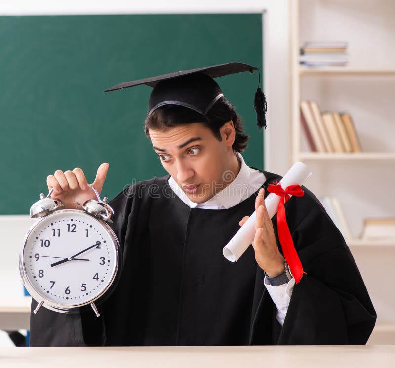 Graduate Student in Front of Green Board Stock Photo - Image of book ...