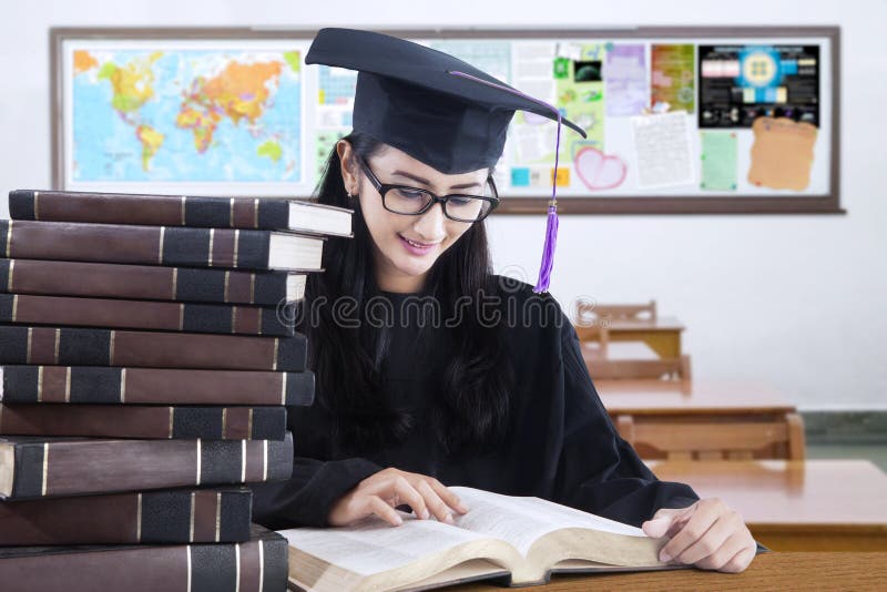 A Diploma is Reading Books at Reading Room Stock Photo - Image of ...