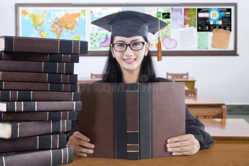 Graduate Student with Mortarboard Studying in Class Stock Image - Image ...