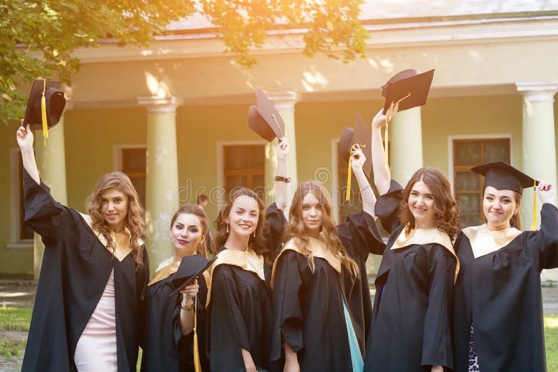 Graduate Students Wearing Graduation Hat and Gown Stock Image - Image ...