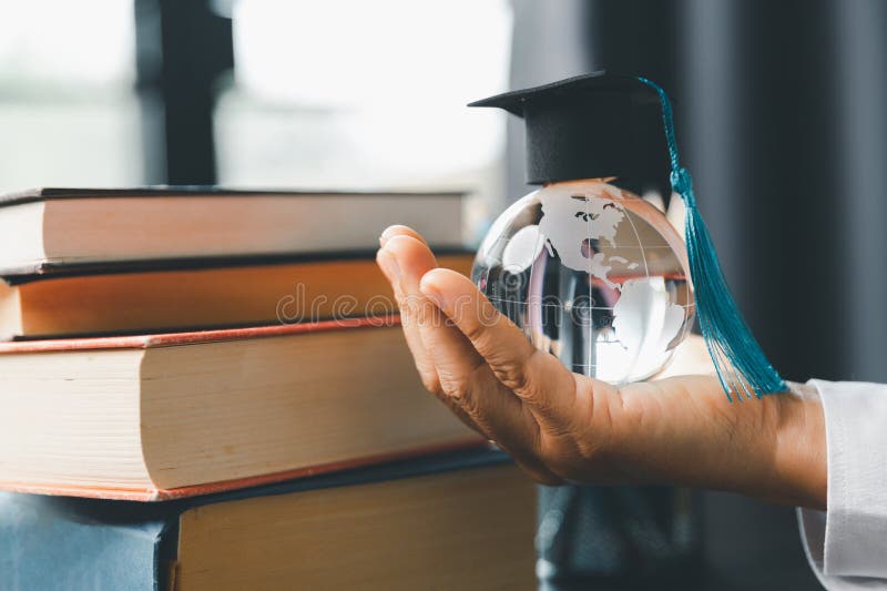 Graduate Study Abroad Program Concept : Black Graduation Cap on a Globe ...