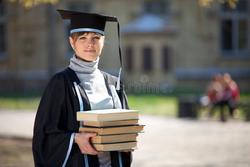 Graduate of University with Books Stock Photo - Image of outdoors ...