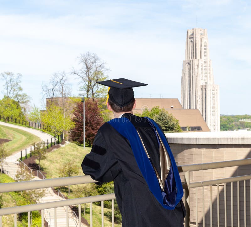 PhD Doctoral Graduate In Regalia Gown, Holding Tudor Bonnet Cap ...